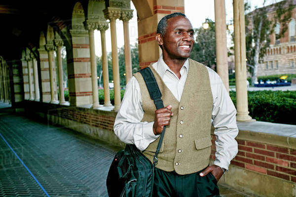 African American professor smiling on campus - Stock Photo - Dissolve
