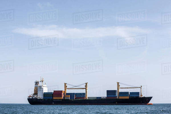 Cargo ship in ocean - Stock Photo - Dissolve