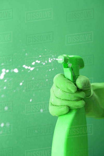 Green rubber glove squiring spray bottle - Royalty-free Stock Photo ...