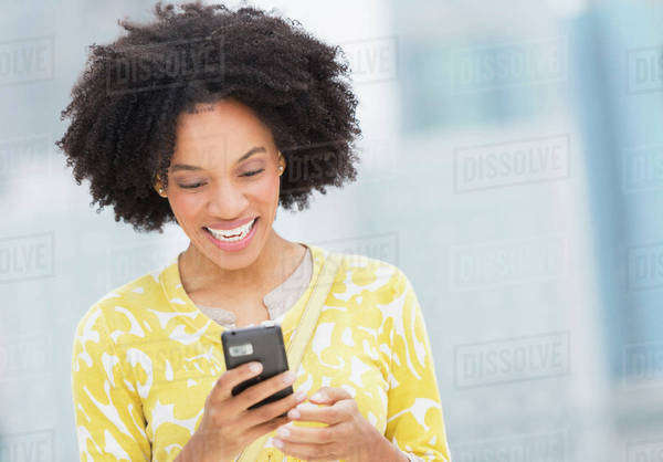 African American using cell phone - Royalty-free Stock Photo | Dissolve