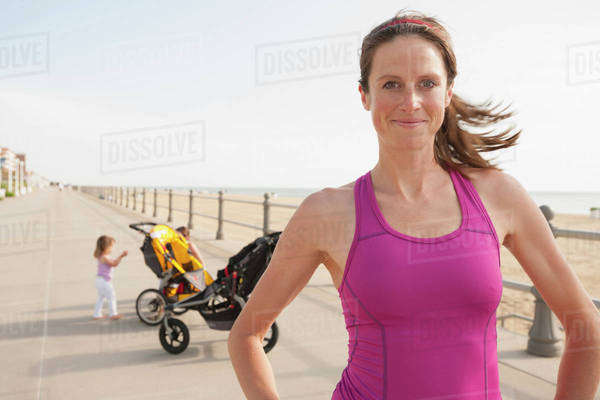 Caucasian woman smiling on beach boardwalk - Royalty-free Stock Photo ...