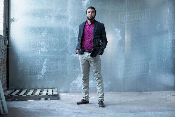 Mixed race businessman standing in warehouse - Royalty-free Stock Photo ...