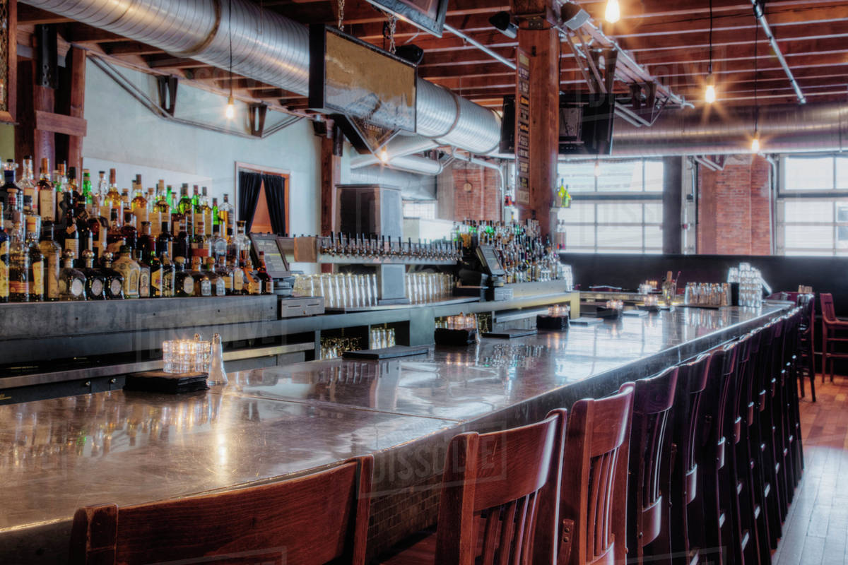 Empty stools at bar - Royalty-free Stock Photo | Dissolve
