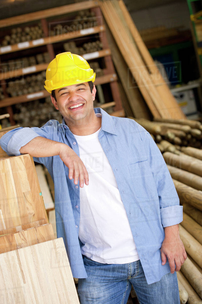Smiling Hispanic carpenter - Stock Photo - Dissolve