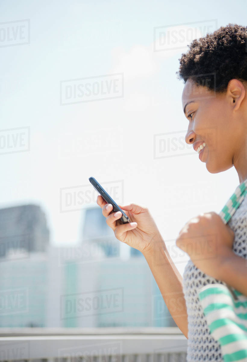 African American woman using cell phone - Royalty-free Stock Photo ...