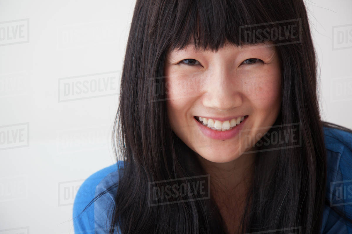 Chinese woman smiling - Royalty-free Stock Photo | Dissolve