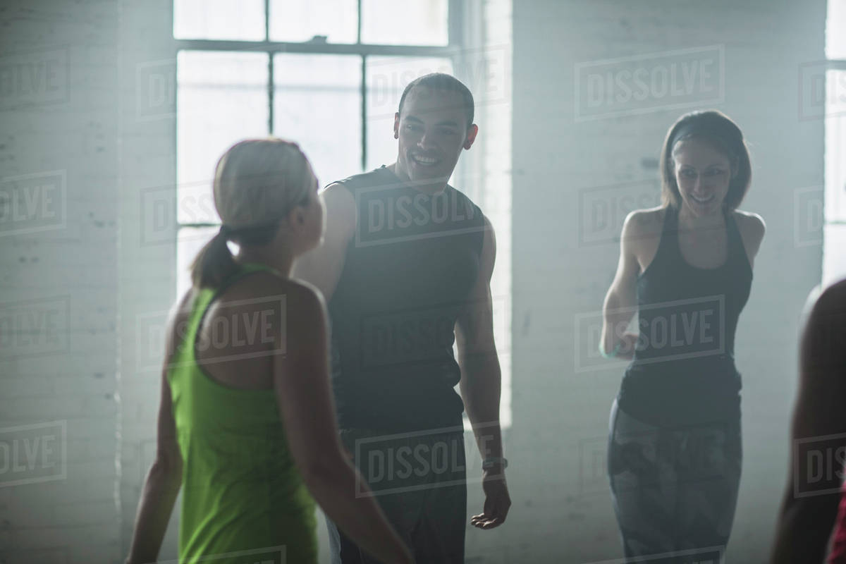 Athletes talking in gym - Royalty-free Stock Photo | Dissolve