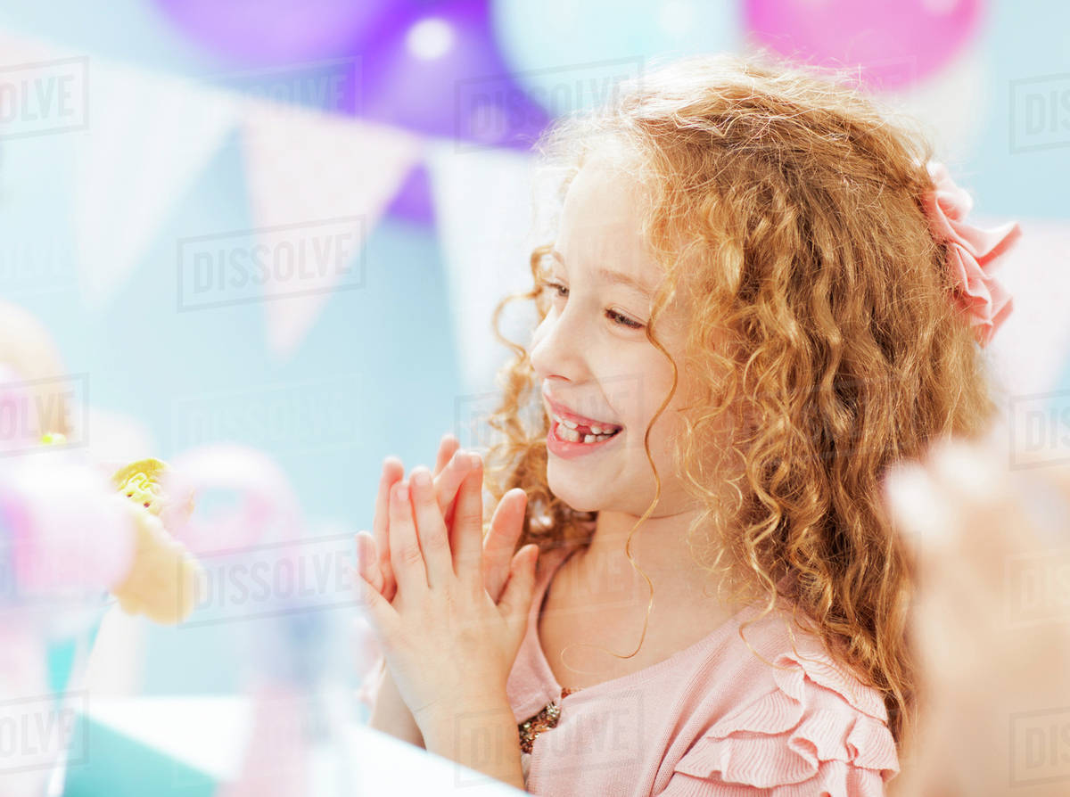 Close up of girl clapping at birthday party - Royalty-free Stock Photo ...