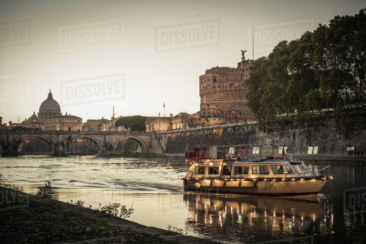 Boat floating on river, Rome, Italy - Stock Photo - Dissolve