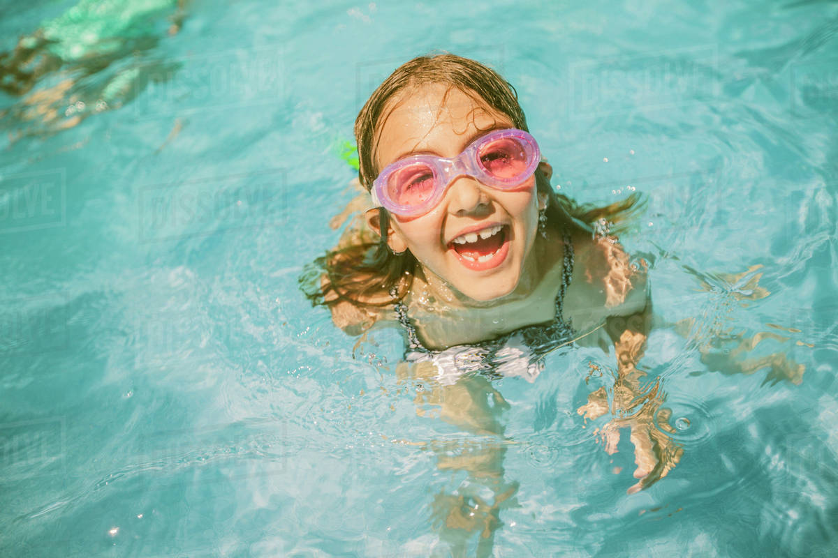 Caucasian girl playing in swimming pool - Royalty-free Stock Photo ...