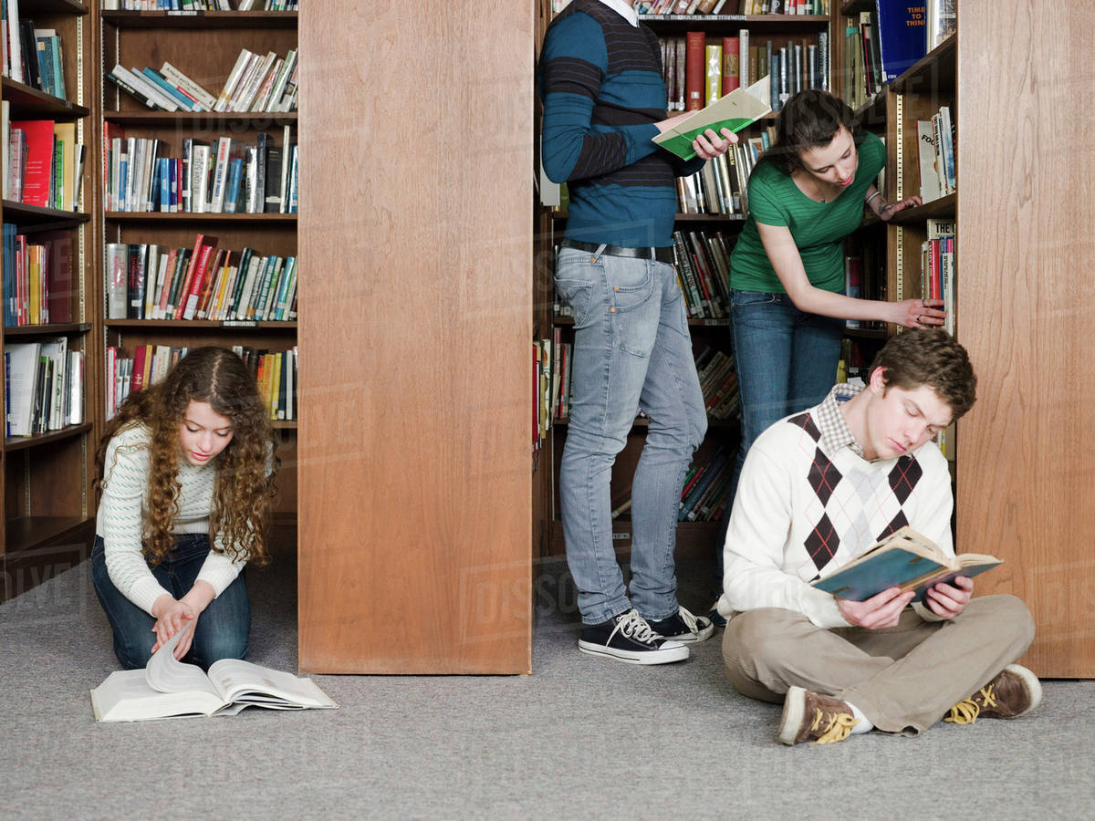 Students reading in library - Royalty-free Stock Photo | Dissolve