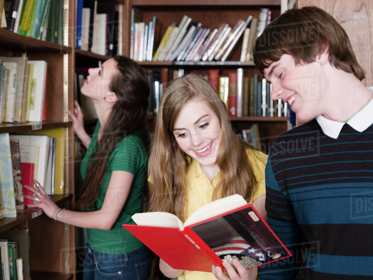 Students reading books in library - Royalty-free Stock Photo | Dissolve