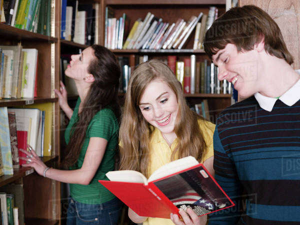 Students reading books in library - Royalty-free Stock Photo | Dissolve