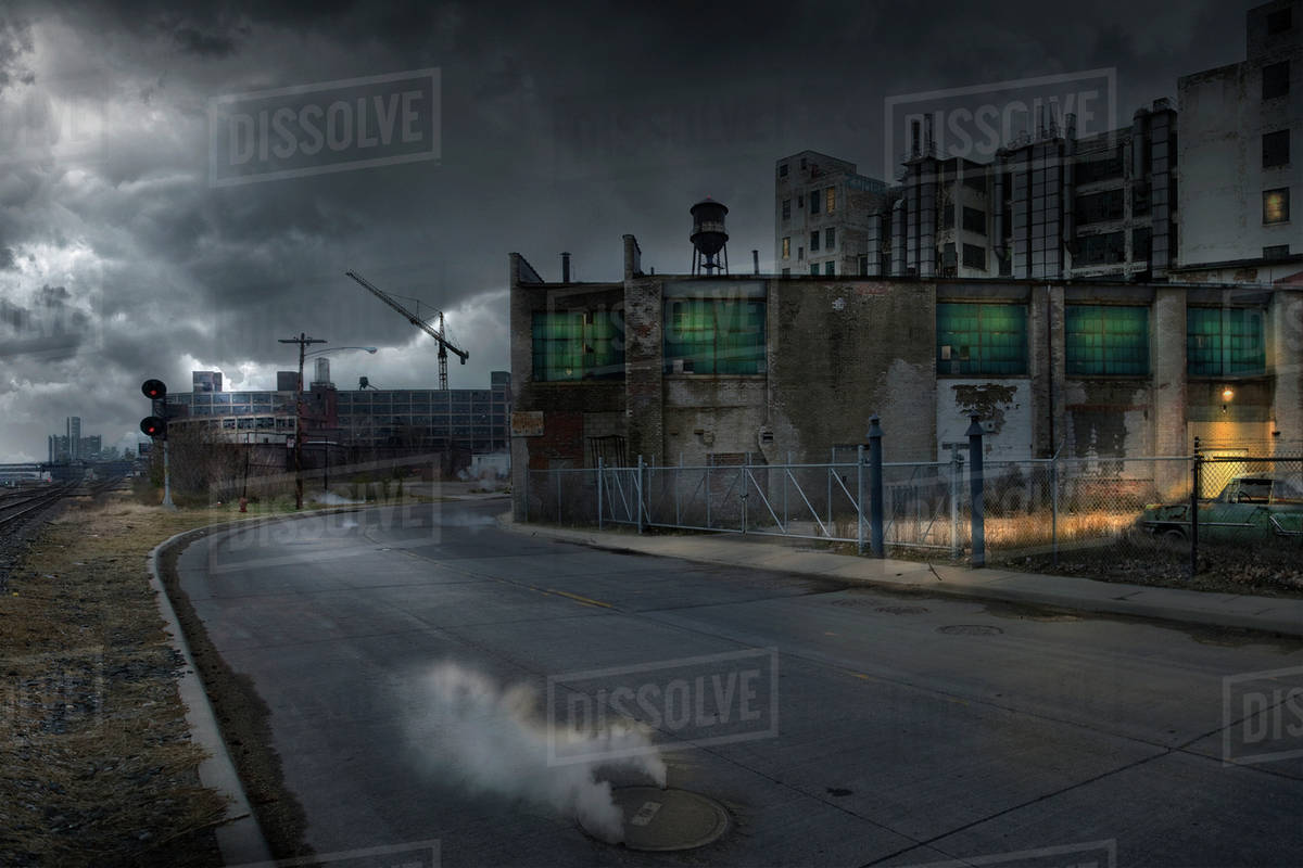 Buildings in dilapidated industrial city - Stock Photo - Dissolve