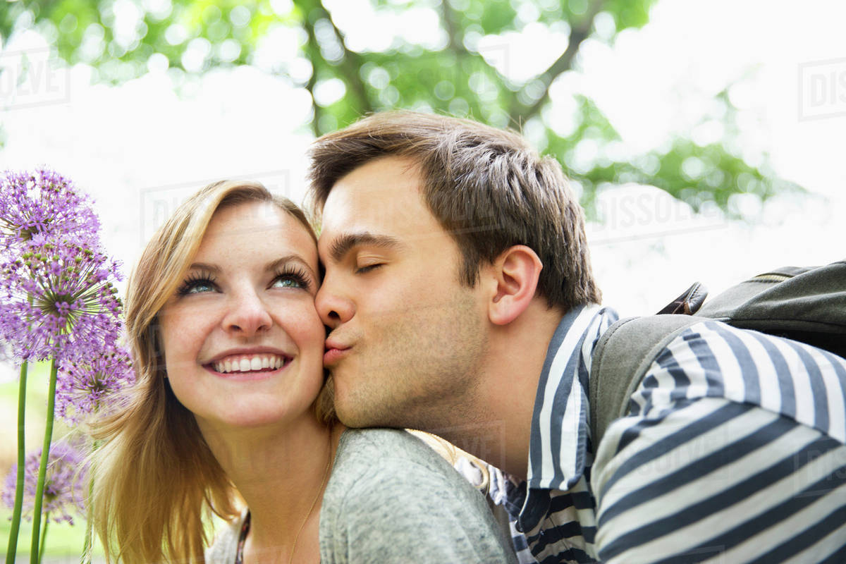 Caucasian couple kissing - Royalty-free Stock Photo | Dissolve