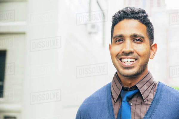 Indian man smiling outdoors - Royalty-free Stock Photo | Dissolve