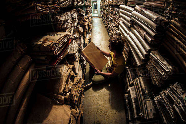 Caucasian man reading book in library archive - Royalty-free Stock ...