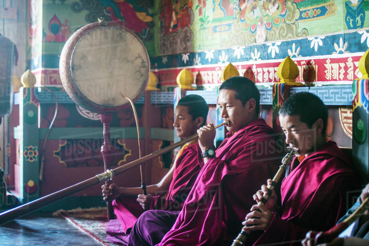 Asian monks playing instruments on temple floor - Royalty-free Stock ...