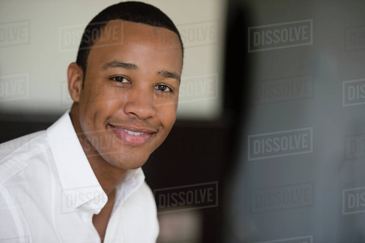 Smiling mixed race man - Royalty-free Stock Photo | Dissolve