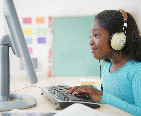 Black student using computer in classroom - Royalty-free Stock Photo ...