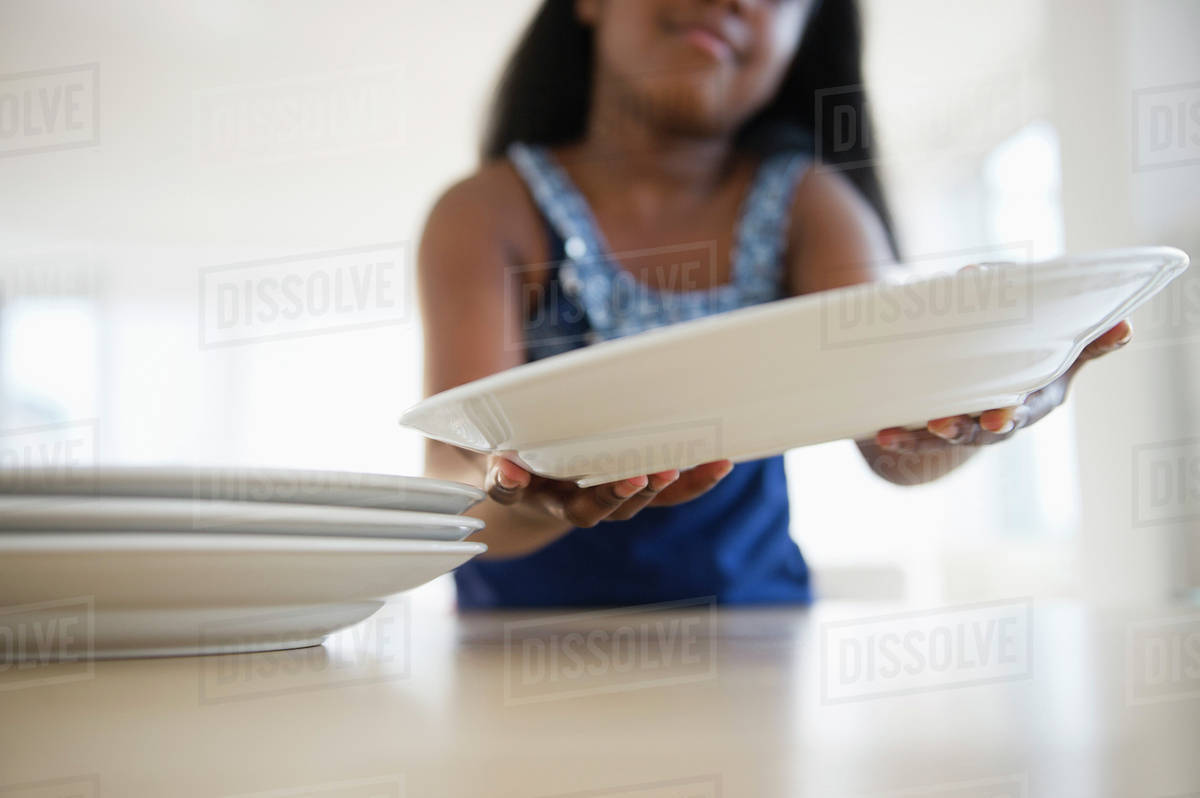 Girl Setting The Table