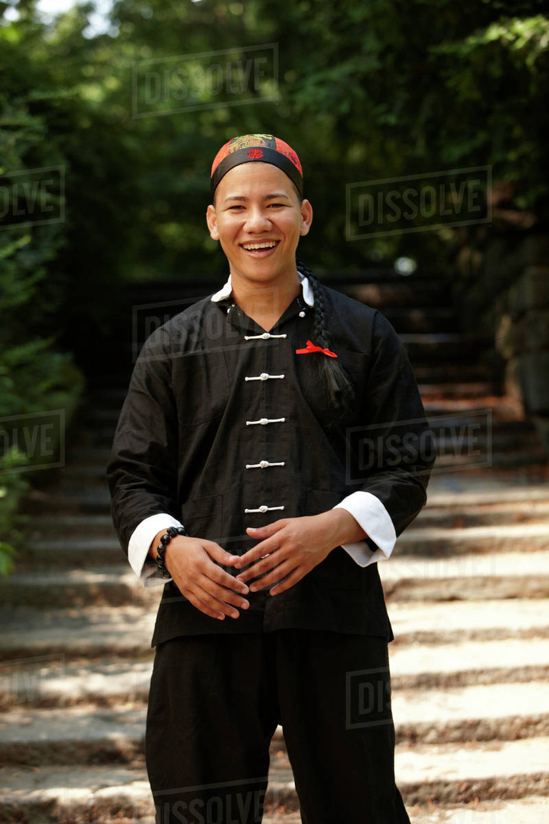 Smiling man in traditional Asian clothing - Royalty-free Stock Photo ...