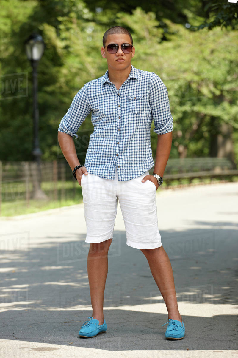 Man standing on path in park - Royalty-free Stock Photo | Dissolve