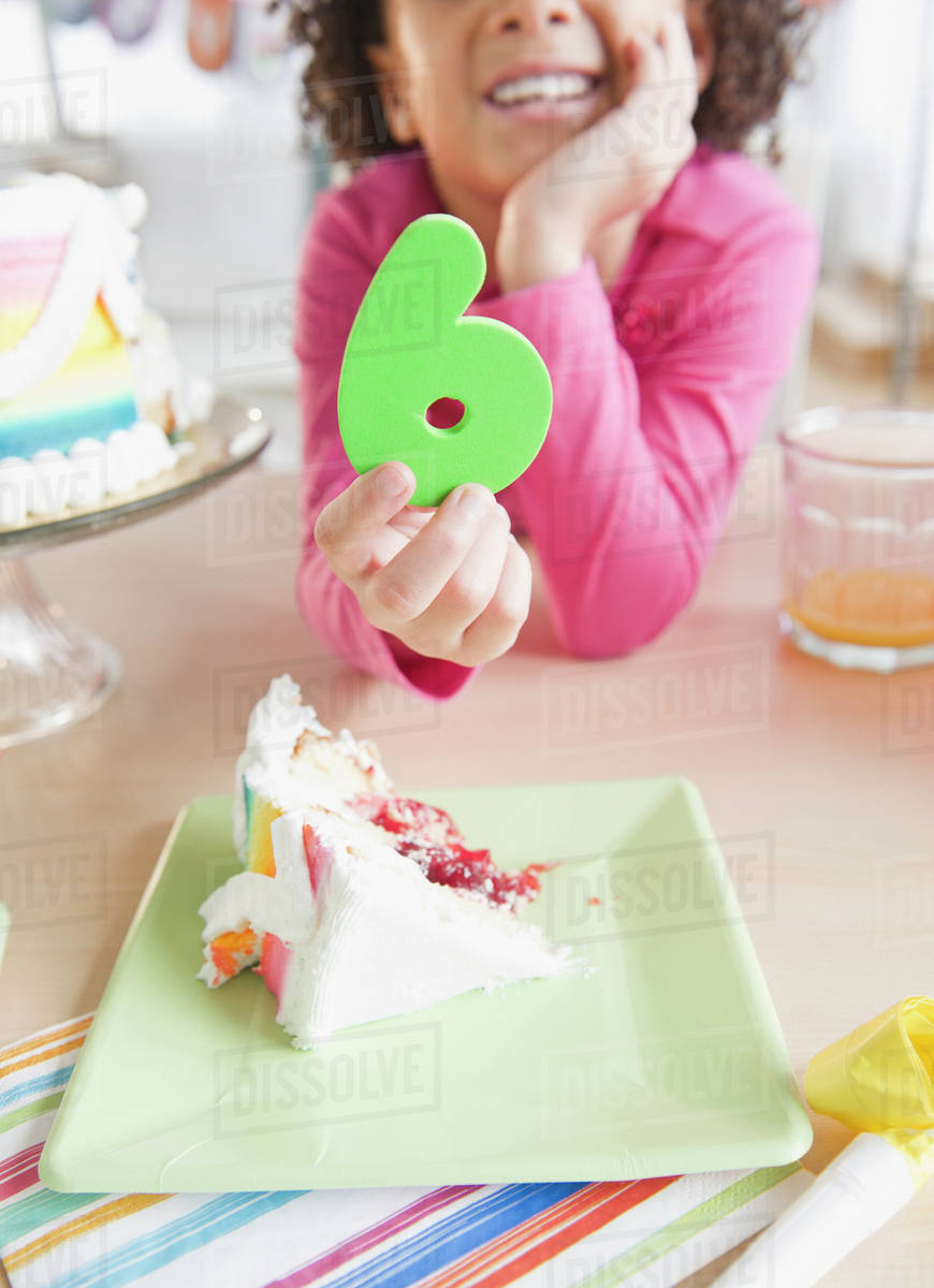 African American girl holding the number 6 at birthday party - Royalty ...