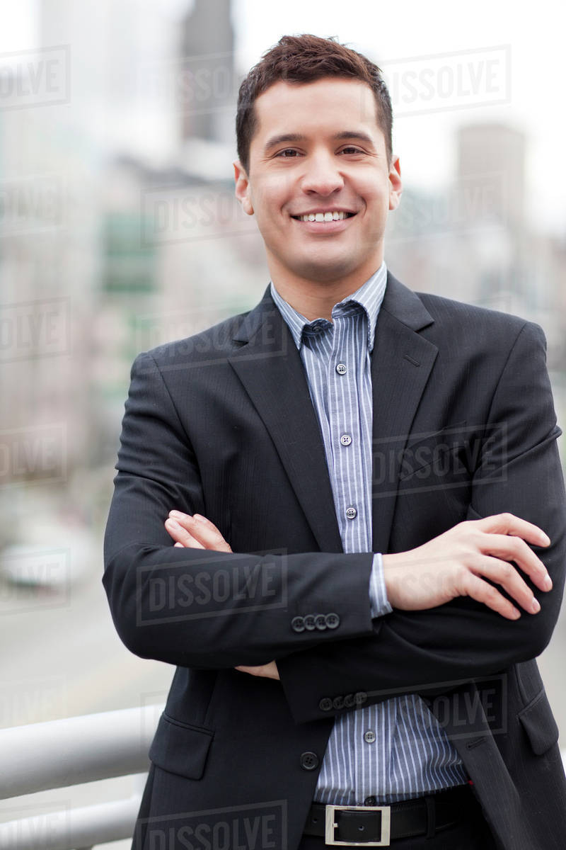 Mixed race businessman standing outdoors - Royalty-free Stock Photo ...