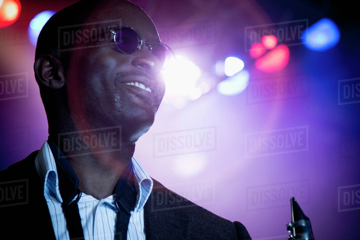 Black musician on stage - Royalty-free Stock Photo | Dissolve