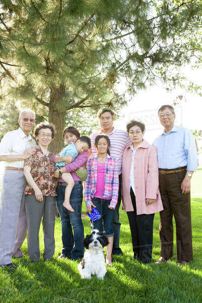 Chinese multi-generation family standing together outdoors - Royalty ...