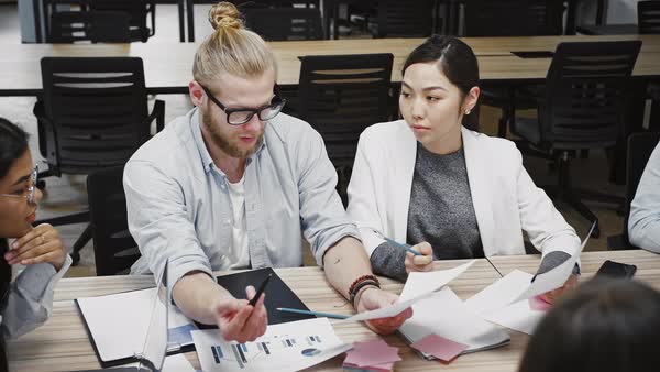 Collaborative process of diverse employees and their boss discussing ...