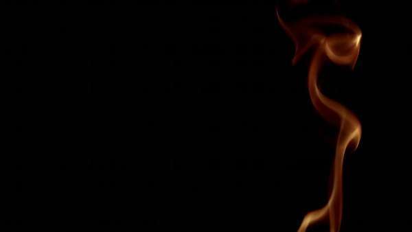 fire-colored smoke stream flows through the screen both violently and ...