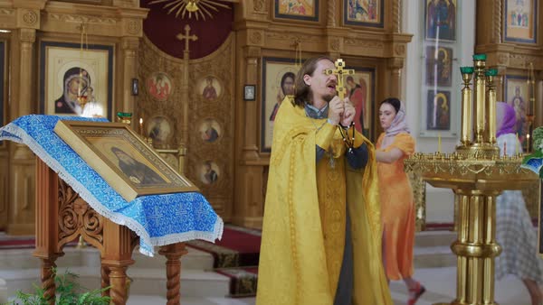 RUSSIA, KAZAN 08-28-2022: baptismal rite in the church - a priest, a ...