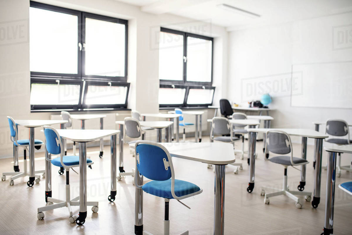 Desks in unconventional classoom, interior of private school. - Royalty ...