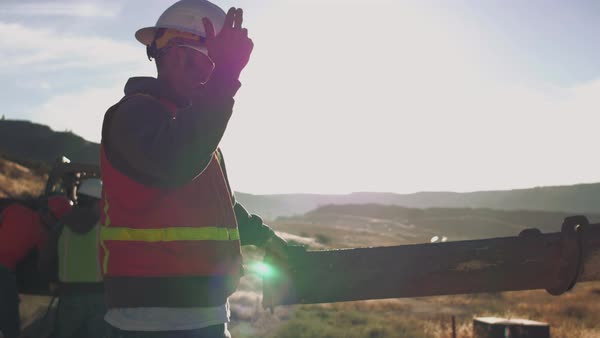 Cinematic shot of construction worker directing concrete truck - Stock ...