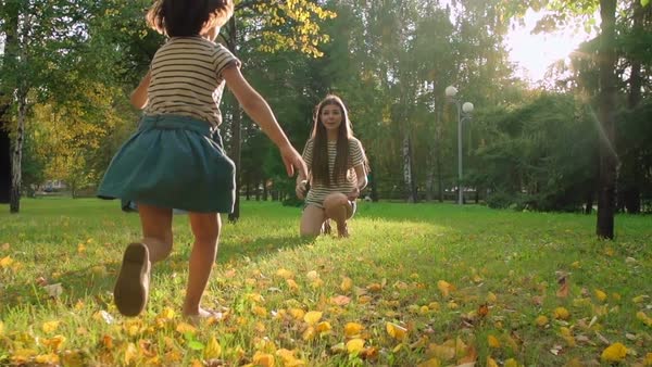 Little girl running to hug her lovely mom in the park - HD Royalty-free ...