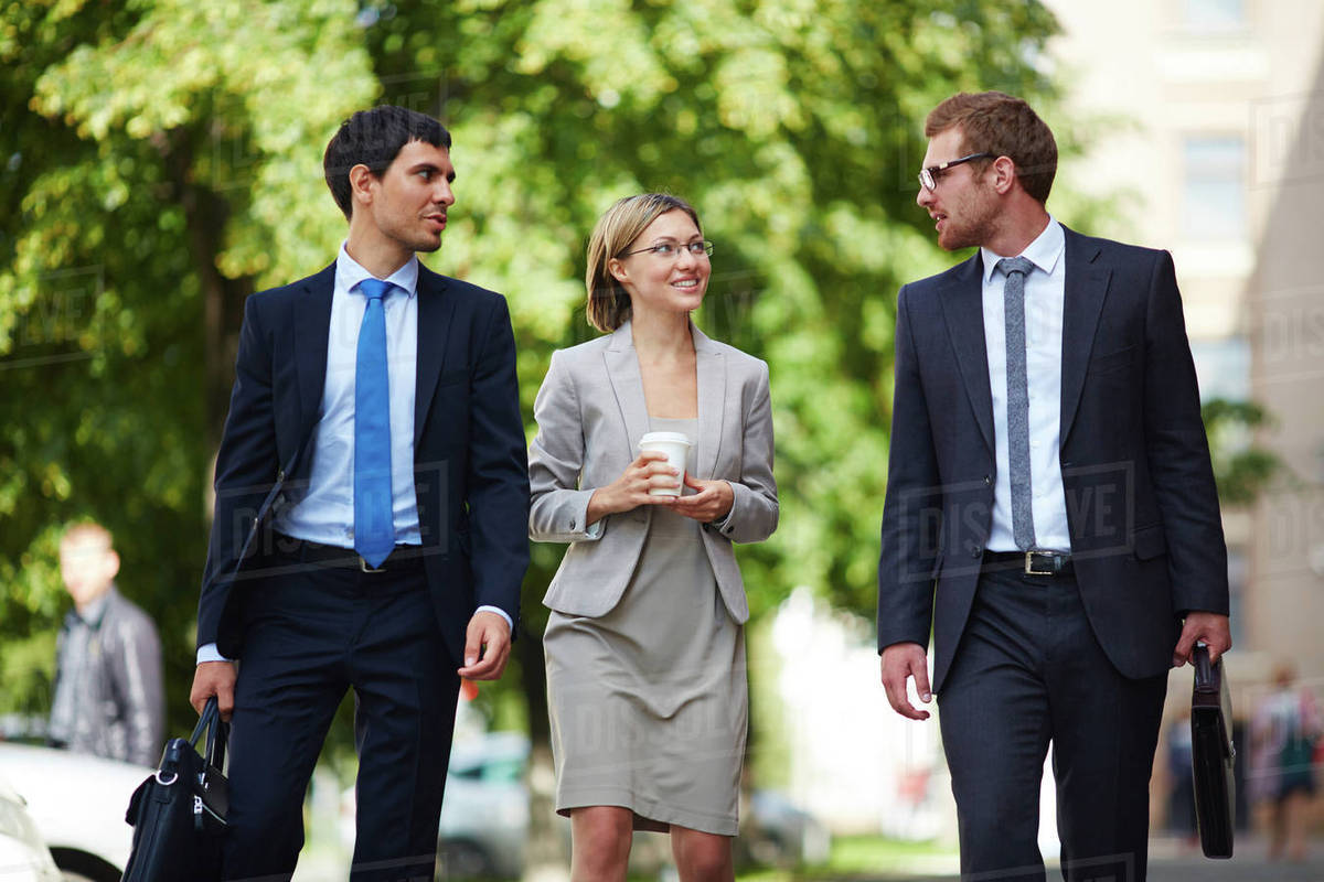 Three managers talking during outdoor break - Royalty-free Stock Photo ...