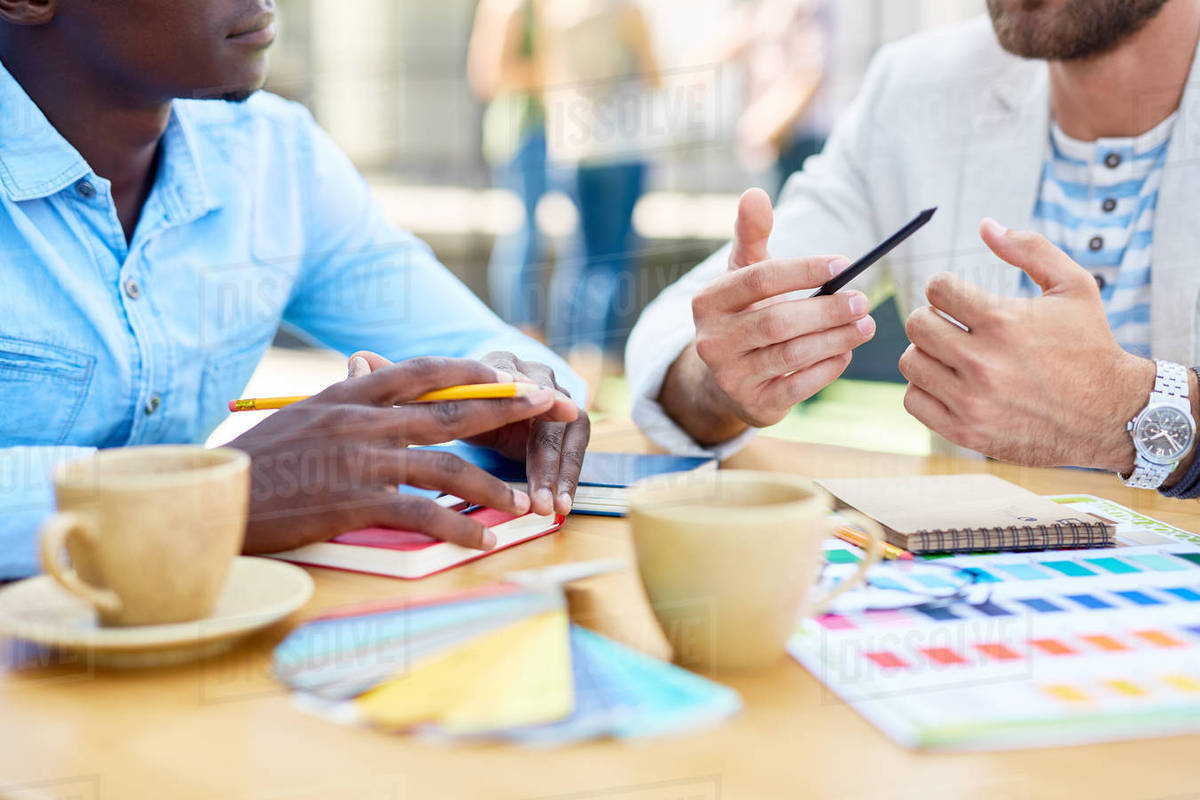 Human hands during business discussion - Stock Photo - Dissolve