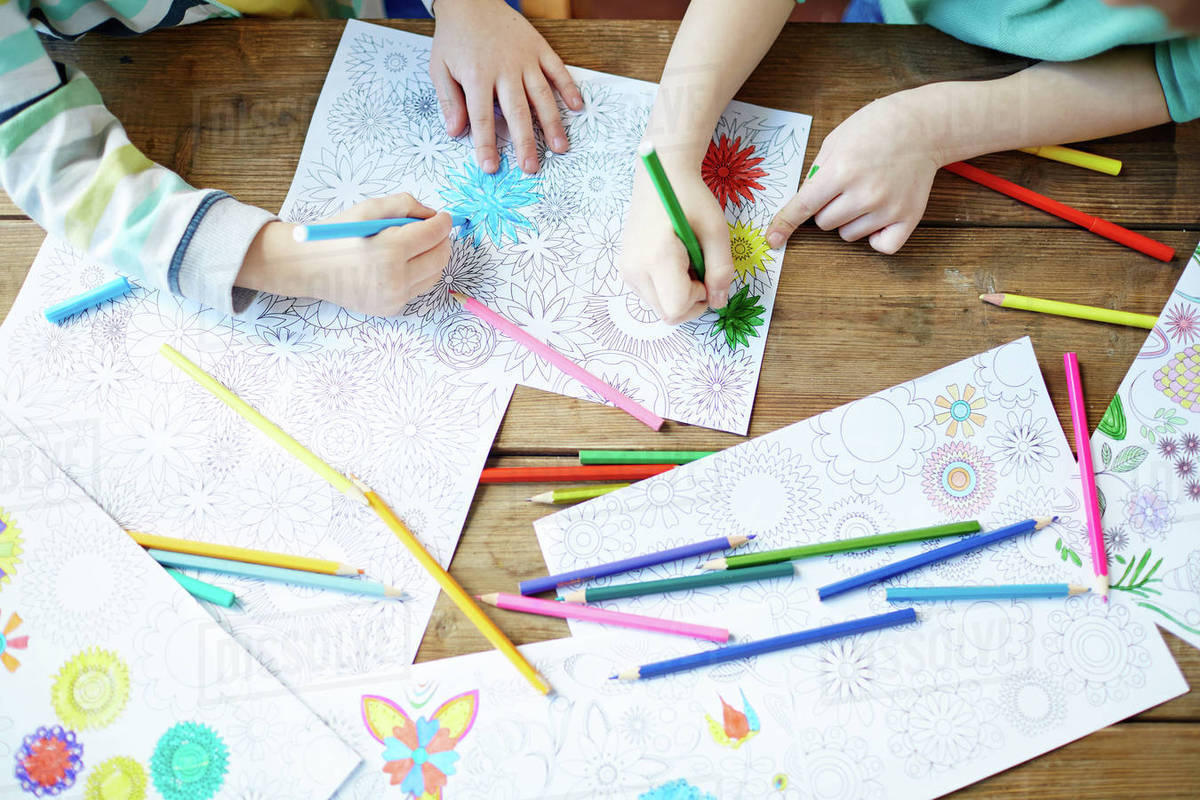 Kids coloring pictures with crayons and highlighters - Royalty-free ...