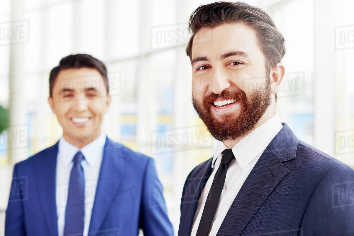 Portrait of two smiling businessmen - Royalty-free Stock Photo | Dissolve