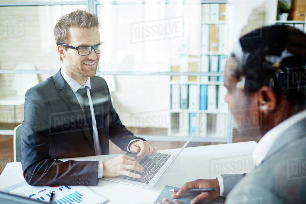 Manager talking to his client - Royalty-free Stock Photo | Dissolve