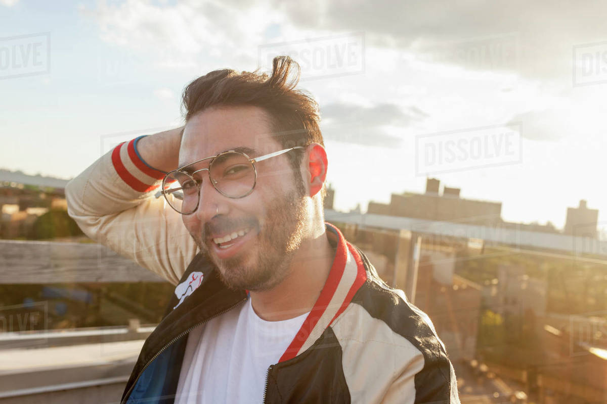 Portrait of a young man on a rooftop - Royalty-free Stock Photo | Dissolve