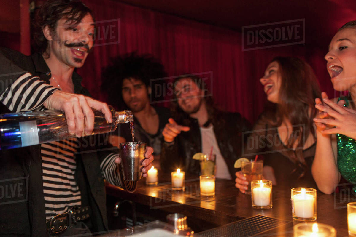 Bartender serving drinks at a nightclub - Royalty-free Stock Photo ...