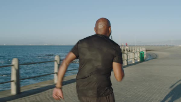 Overweight man running intense workout jogging challenge male ...