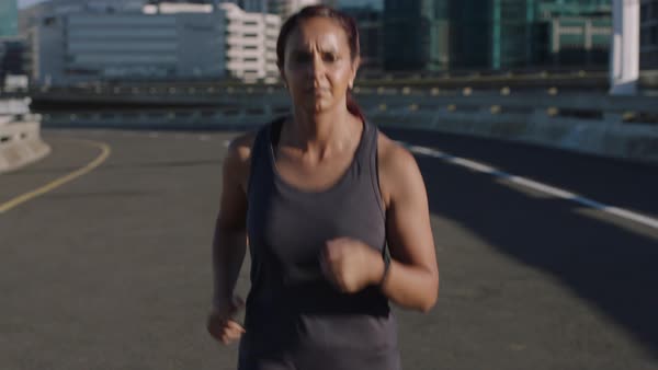 Indian woman running in city enjoying healthy fitness lifestyle ...