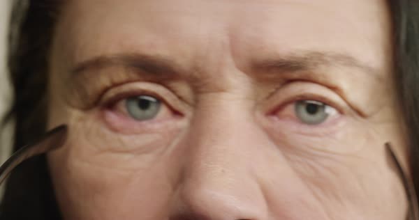 Close up eyes wrinkled old woman wearing glasses aging beauty healthy ...