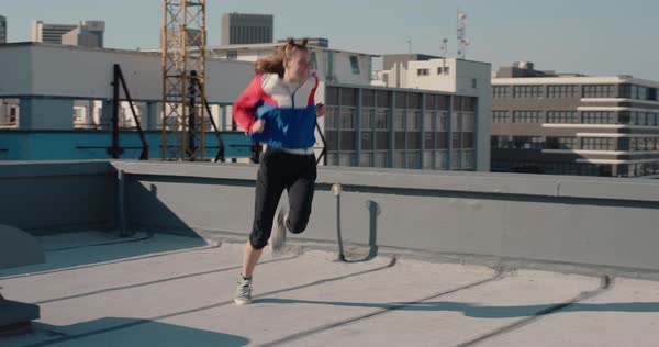 Funny woman dancing on rooftop celebrating enjoying silly dance having ...