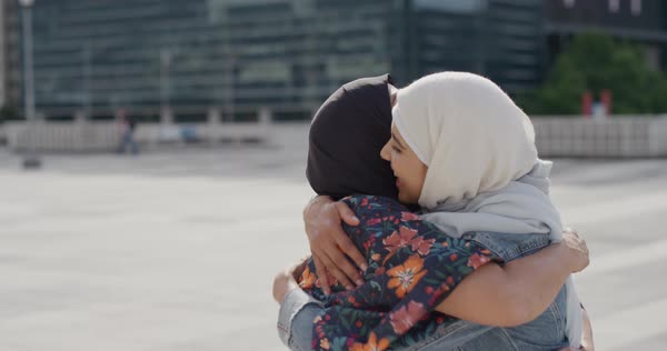 Portrait happy muslim woman mother hugging daughter smiling enjoying ...