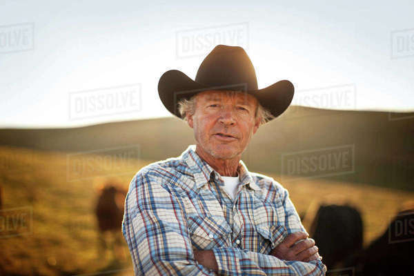 Portrait of a rancher on a paddock. - Royalty-free Stock Photo | Dissolve